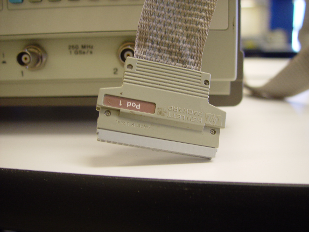 Find a cable with "Pod 1" written on it.